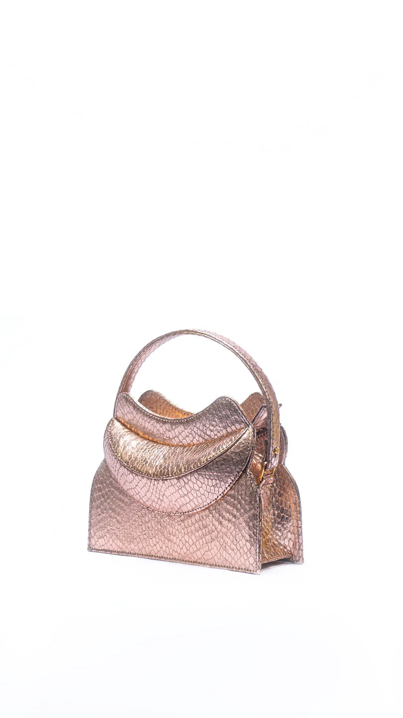 Dada Pedon Luna Metallic Blush Zipper Handbag | African Fashion Brand ...
